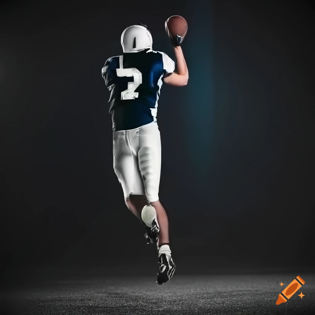 American football player catching a football in back and white