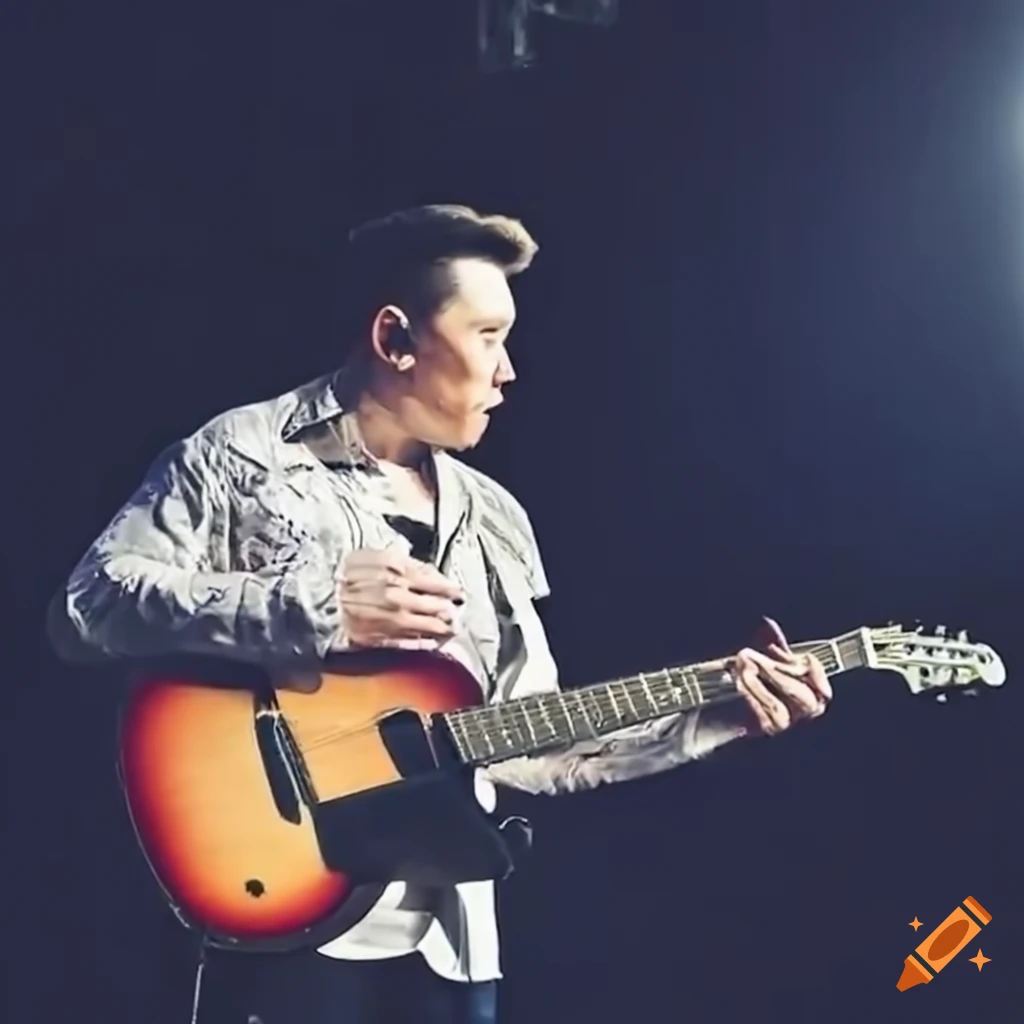 Elon musk playing guitar on stage