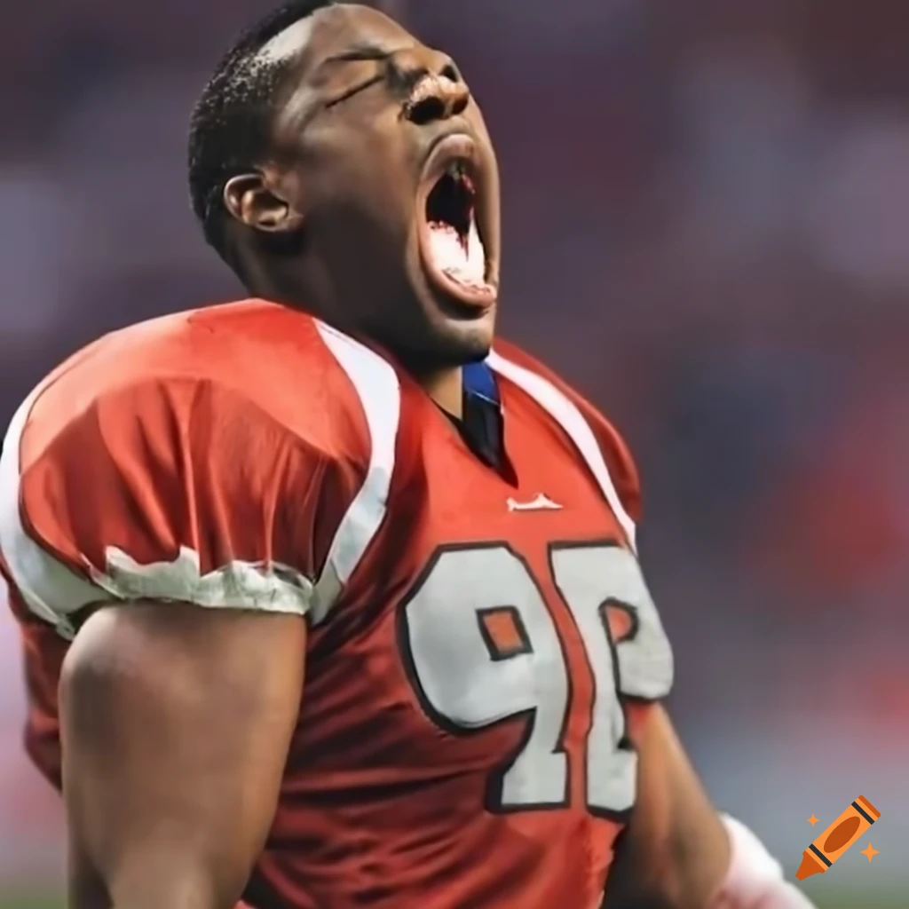 American football player showing intensity and shouting with moderate ...