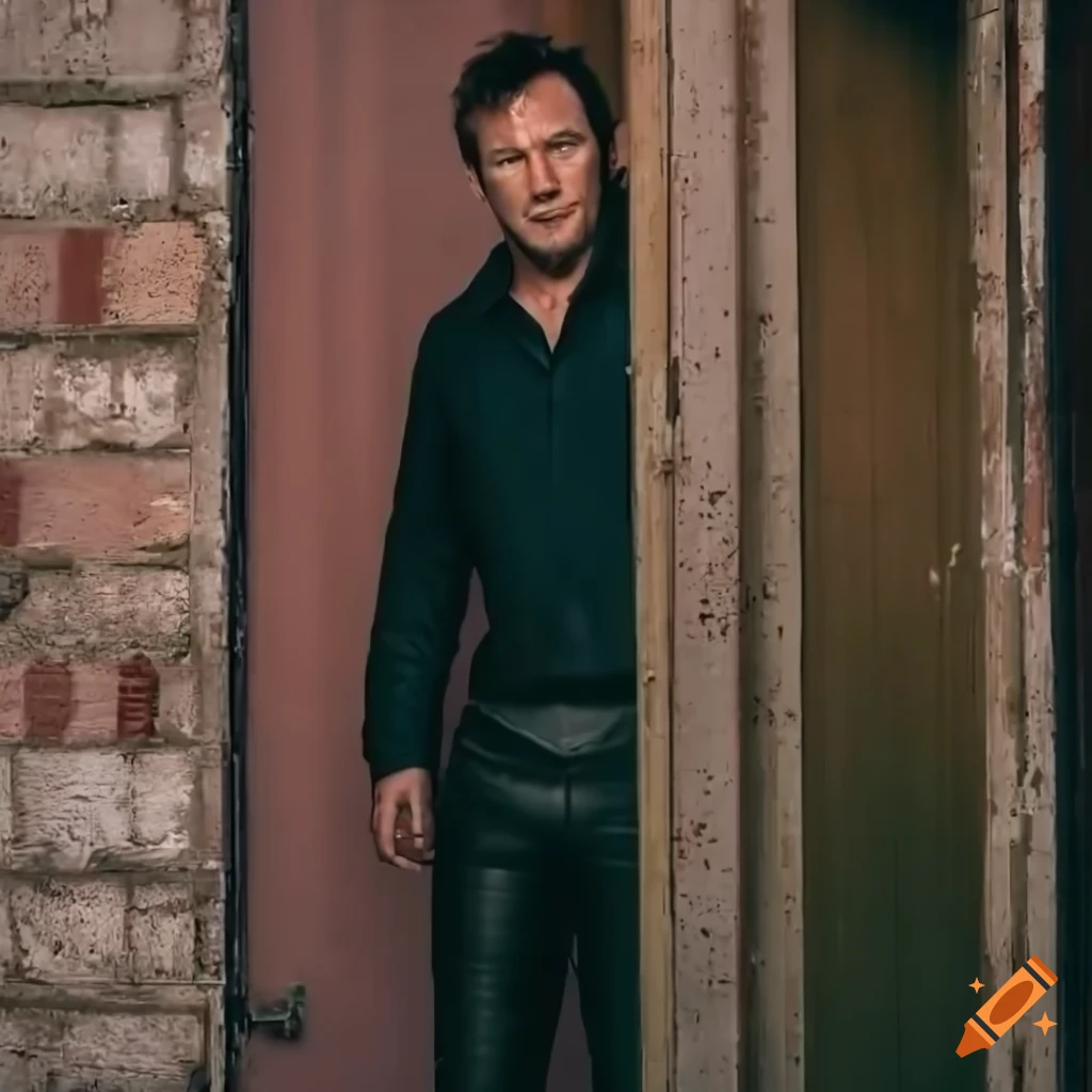 Actor resembling Jason Isaacs at age 20 in an orange plaid shirt and ...