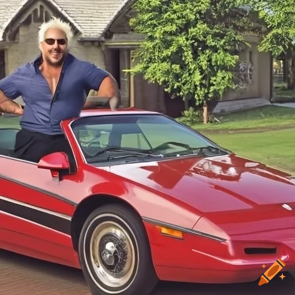 Guy Fieri posing next to a vintage red Pontiac Fiero with delicious ...