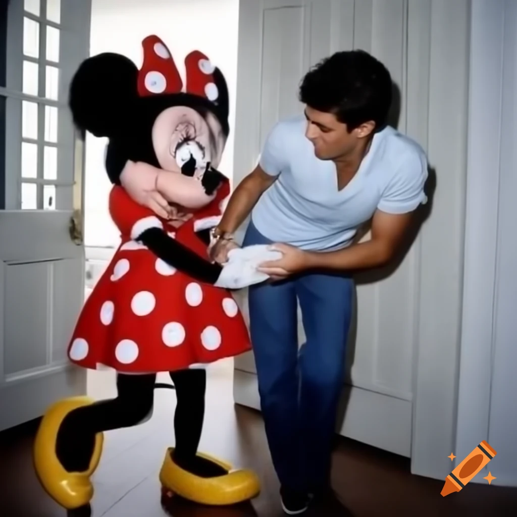 Young man asking minnie mouse mascot to sit on her lap in bright room ...