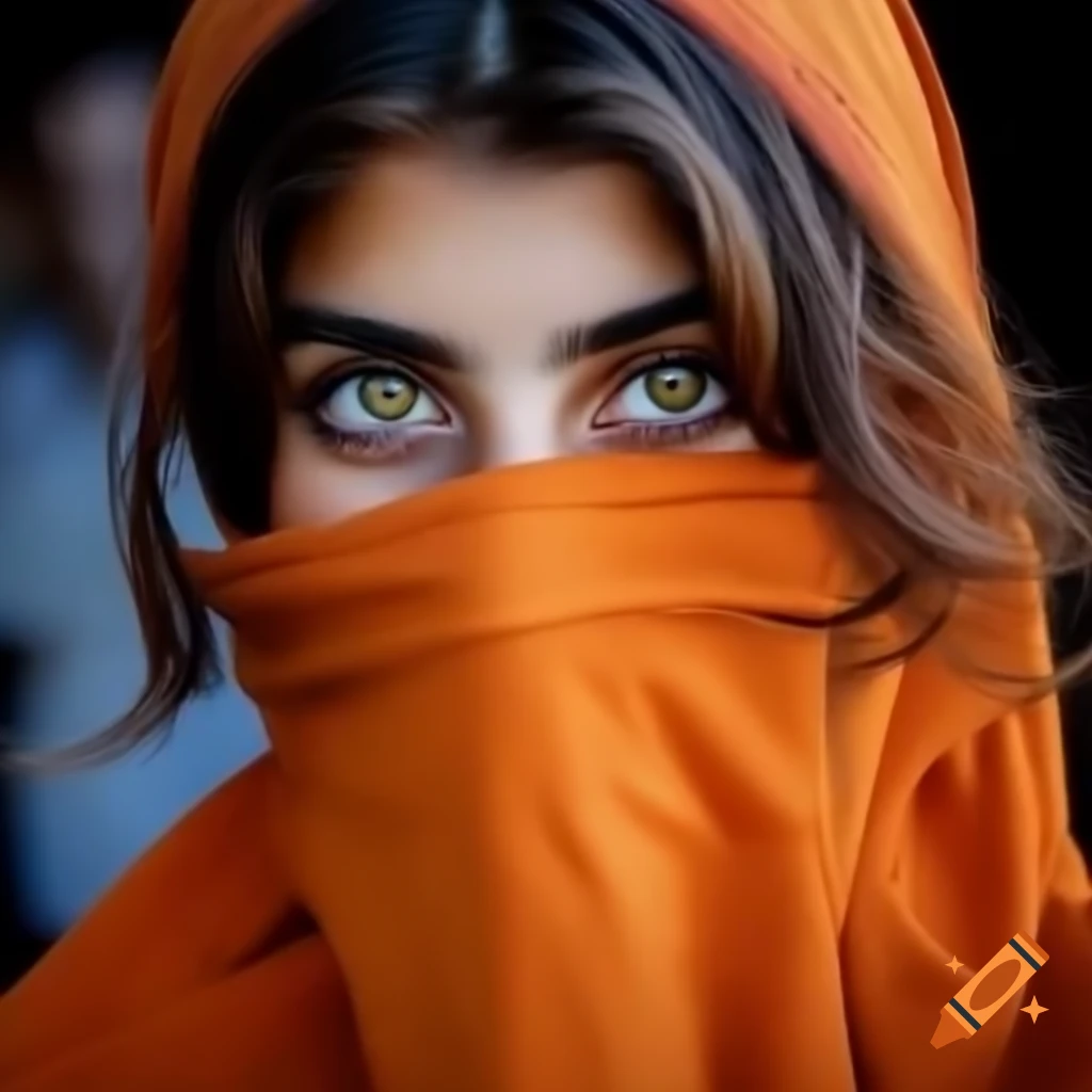 Beautiful Spanish Arabic woman in orange burka with playful expression ...